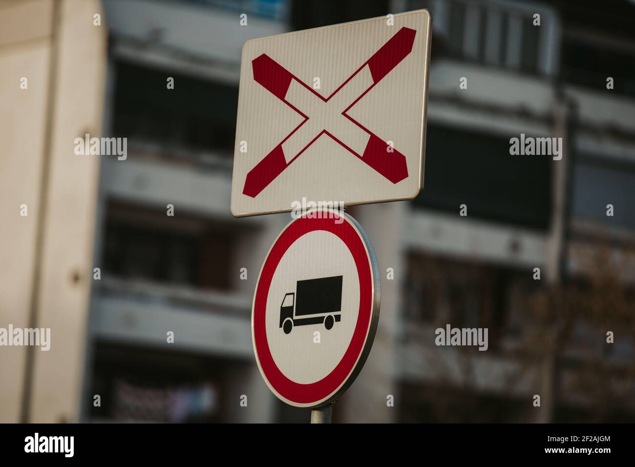 A close-up shot of two different shaped traffic signs on white ...
