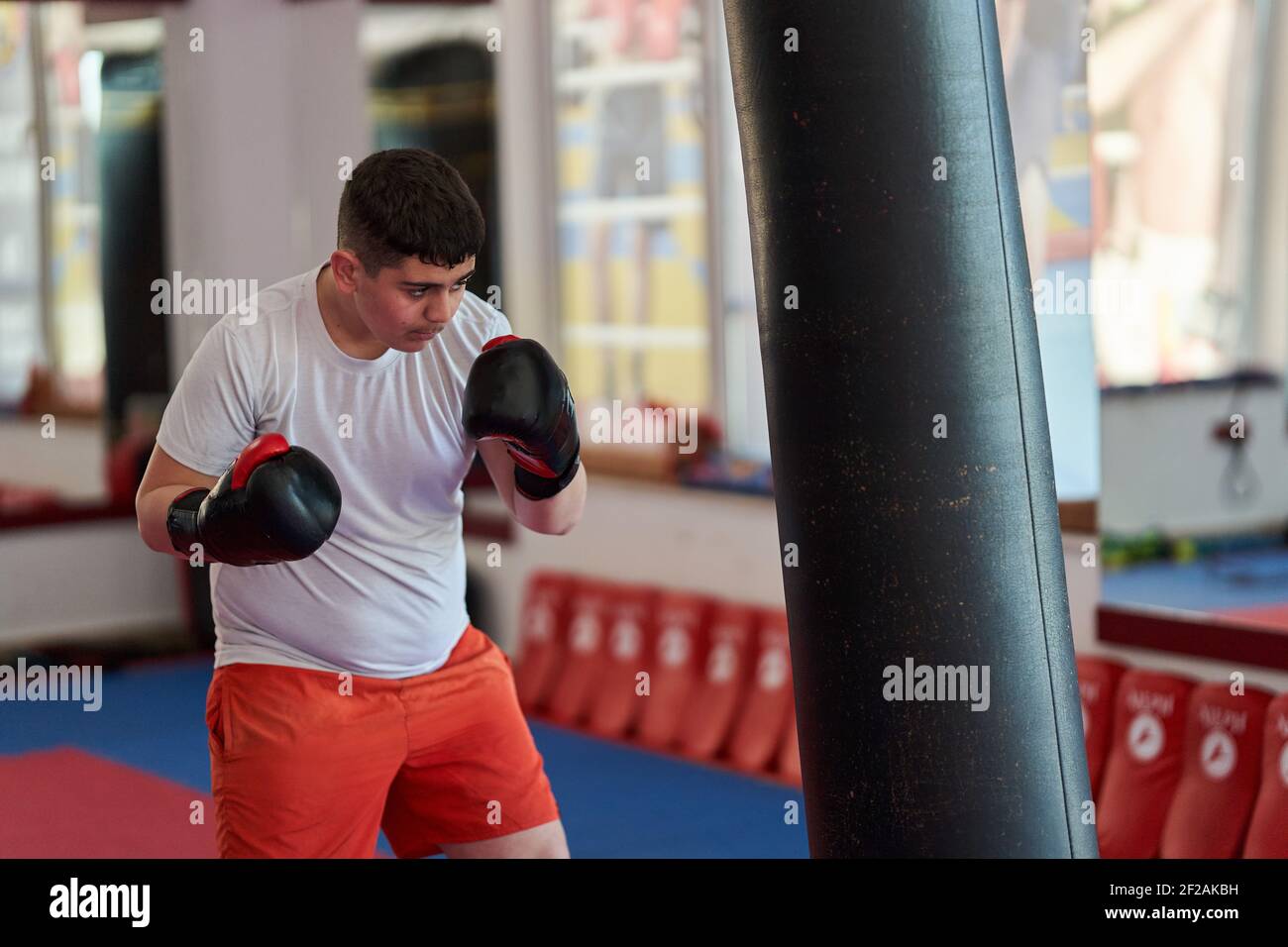 Hitting heavy punch bag hi-res stock photography and images - Alamy