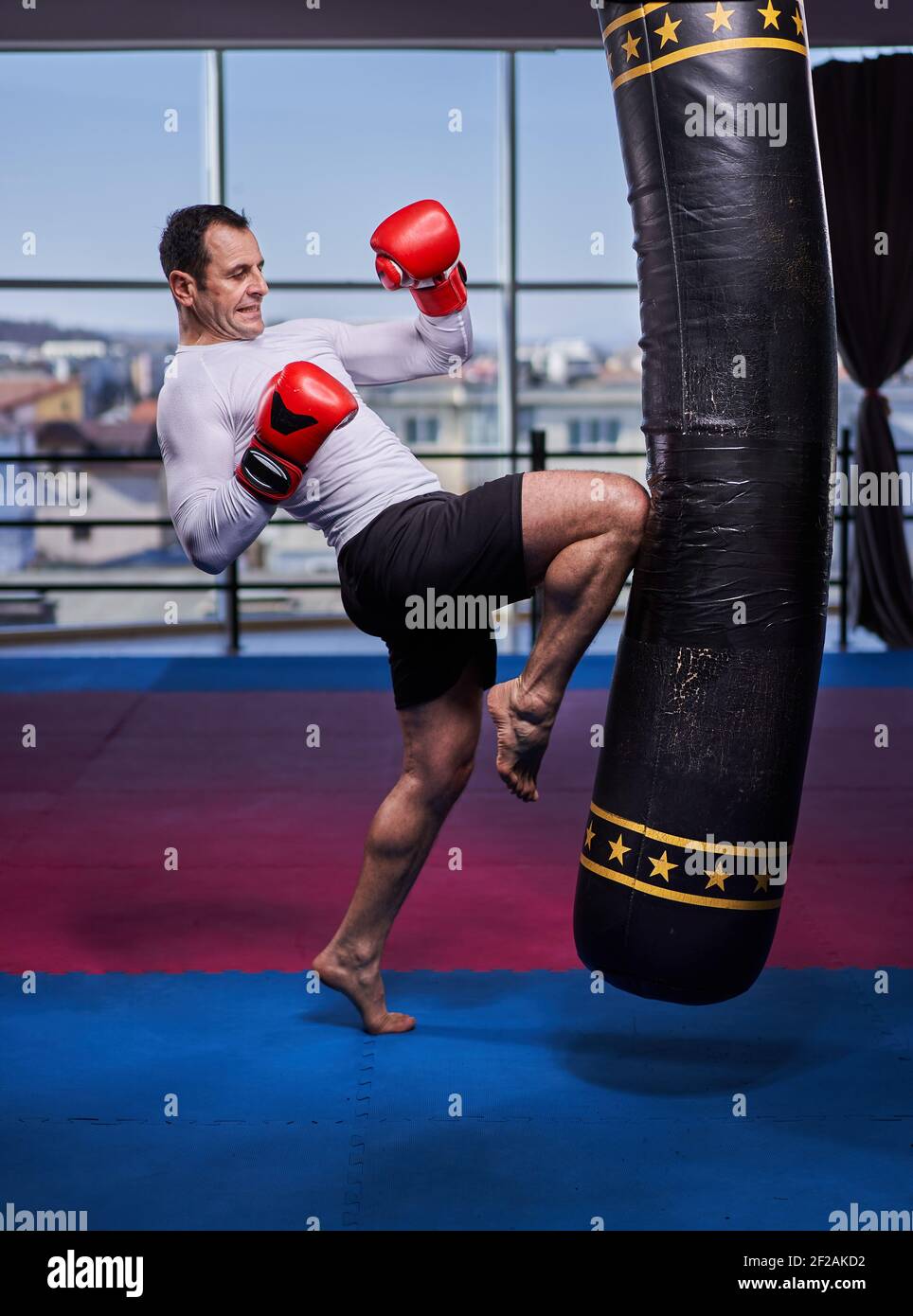 Boxer hitting punchbag hi-res stock photography and images - Alamy