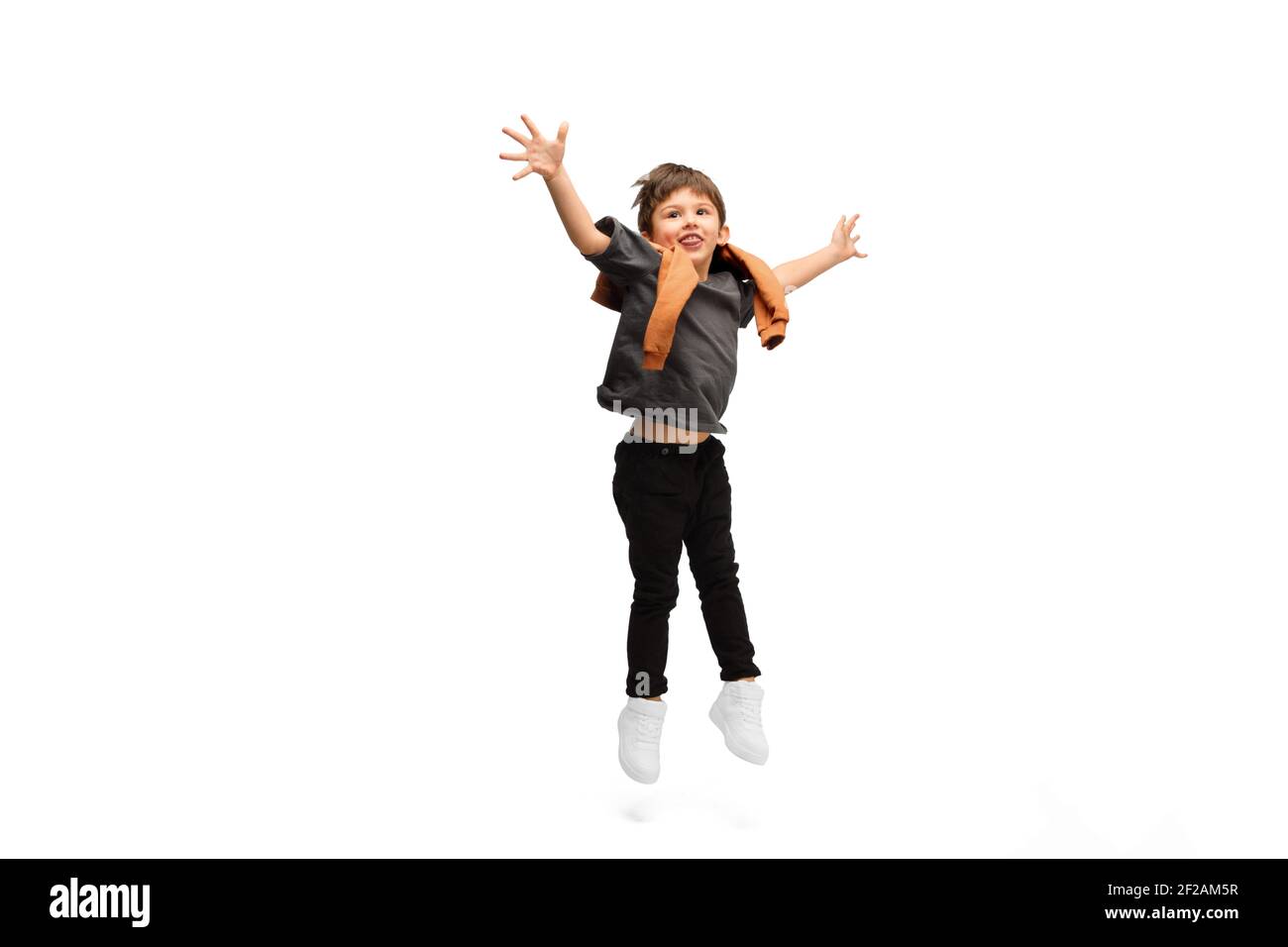 Jumping, flying. Happy, smiley little caucasian boy isolated on white ...