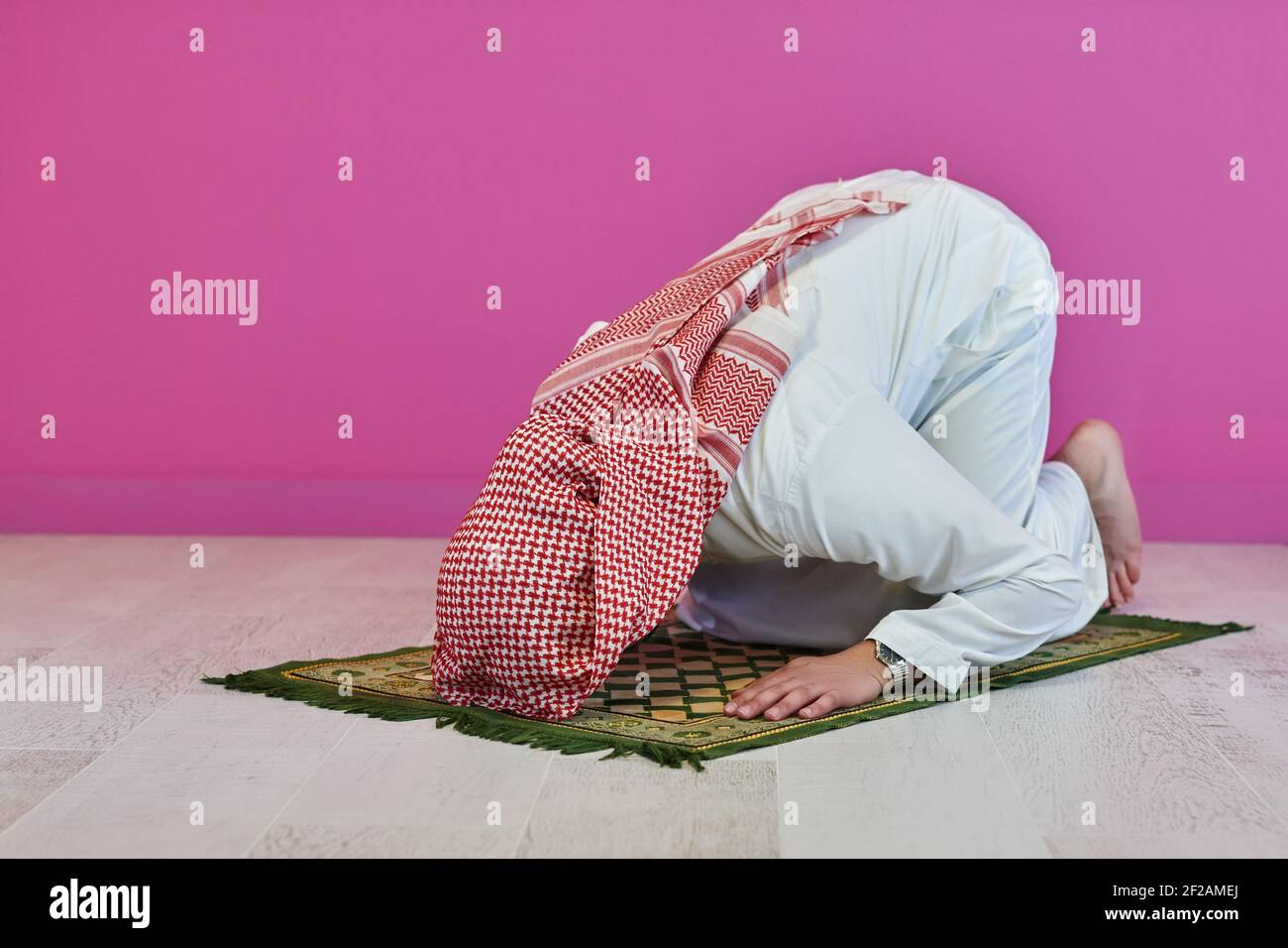 Young muslim man praying salat during Ramadan Stock Photo - Alamy