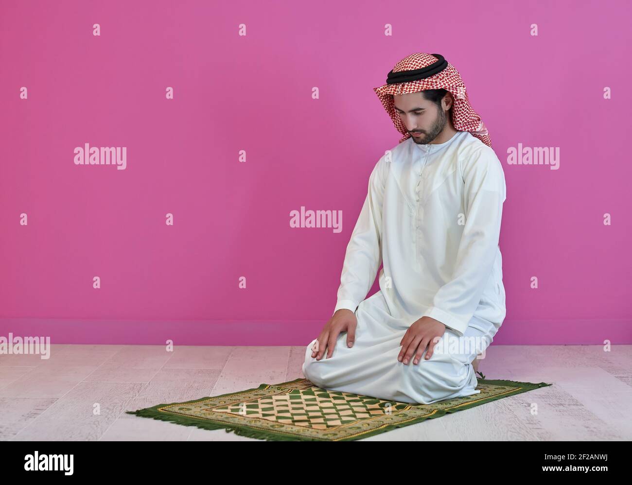 Young muslim man praying salat during Ramadan Stock Photo - Alamy