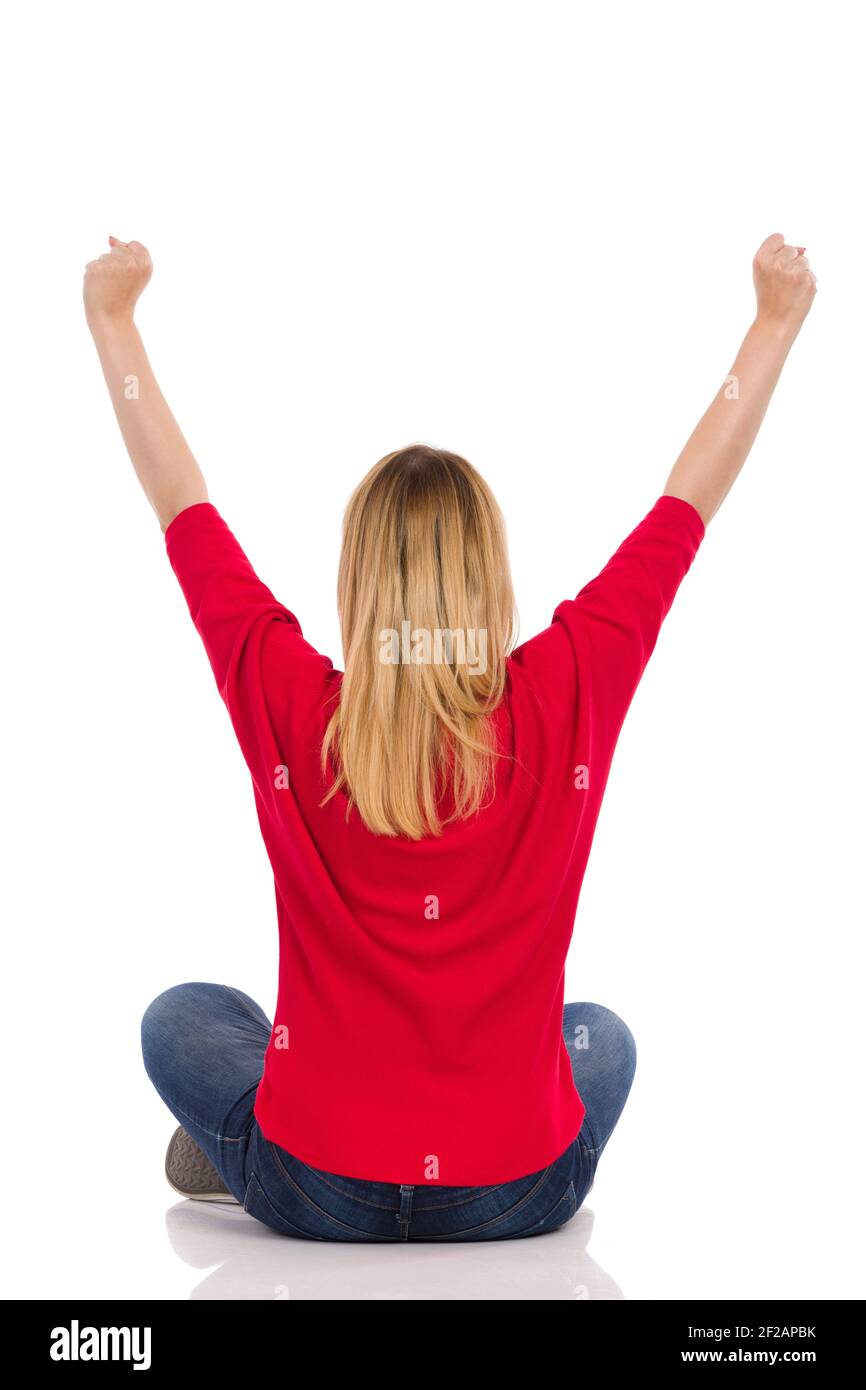 Blond woman fist raised rear view hi-res stock photography and images ...