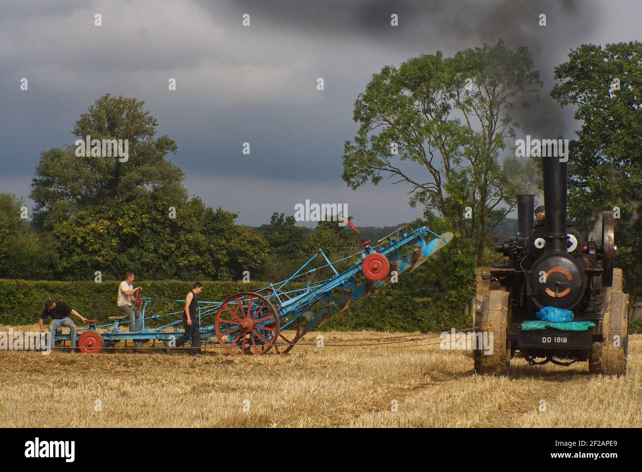 Two steam ploughing engines with plough and ploughmen Stock Photo - Alamy