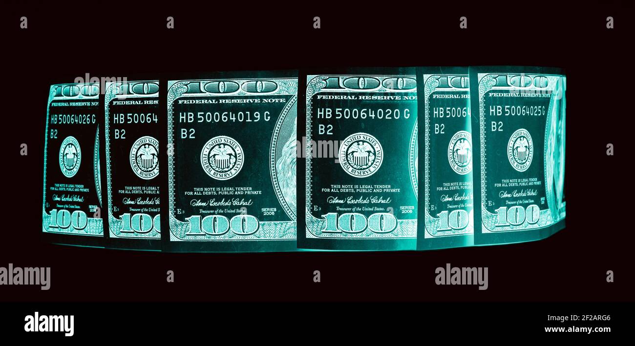One hundred dollar bills (banknotes ) close up, U.S. currency-- in UV ...