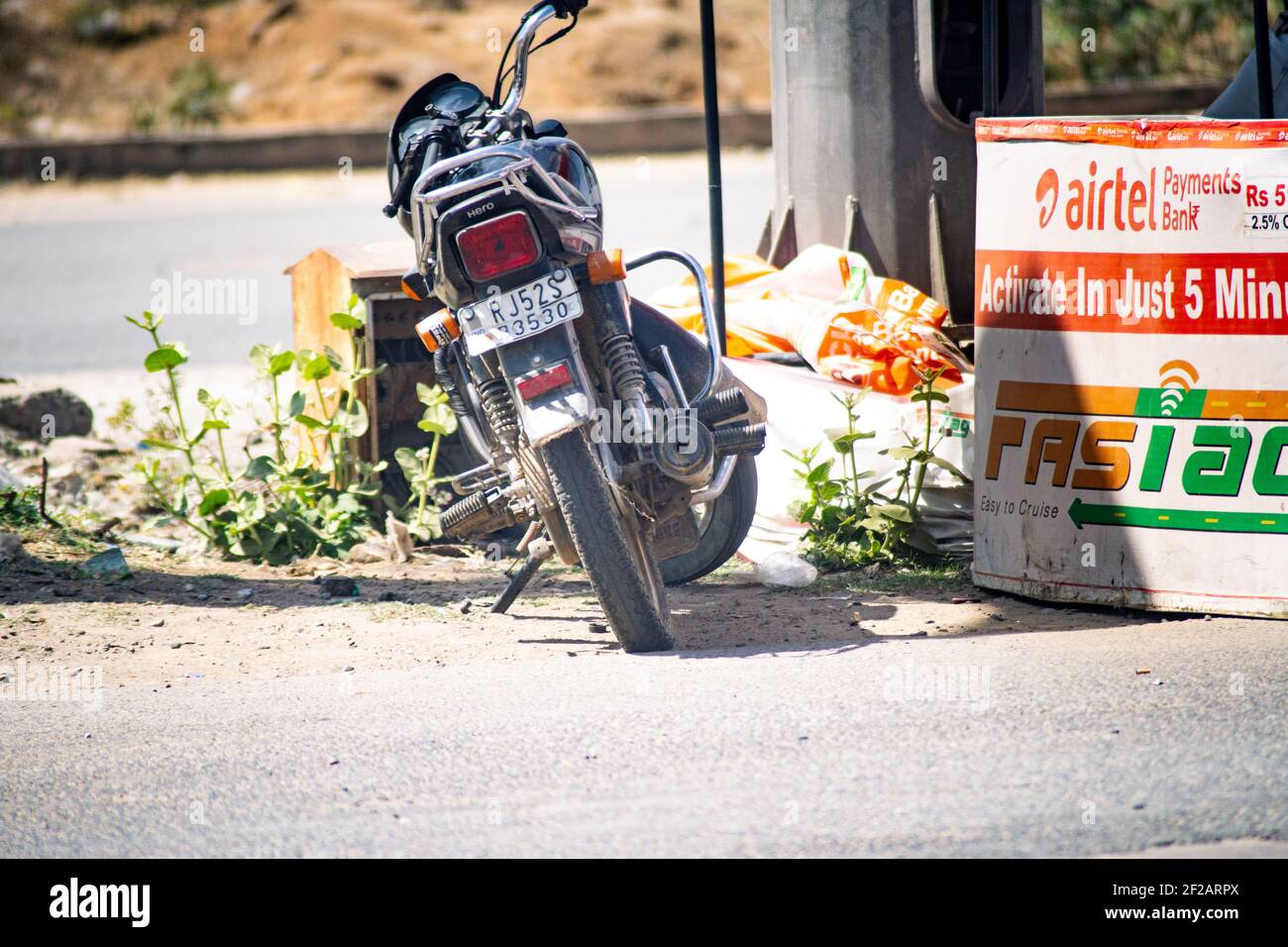 bike parked near an airtel FASTag fast tag RFID cashless payment system made mandatory by the ...