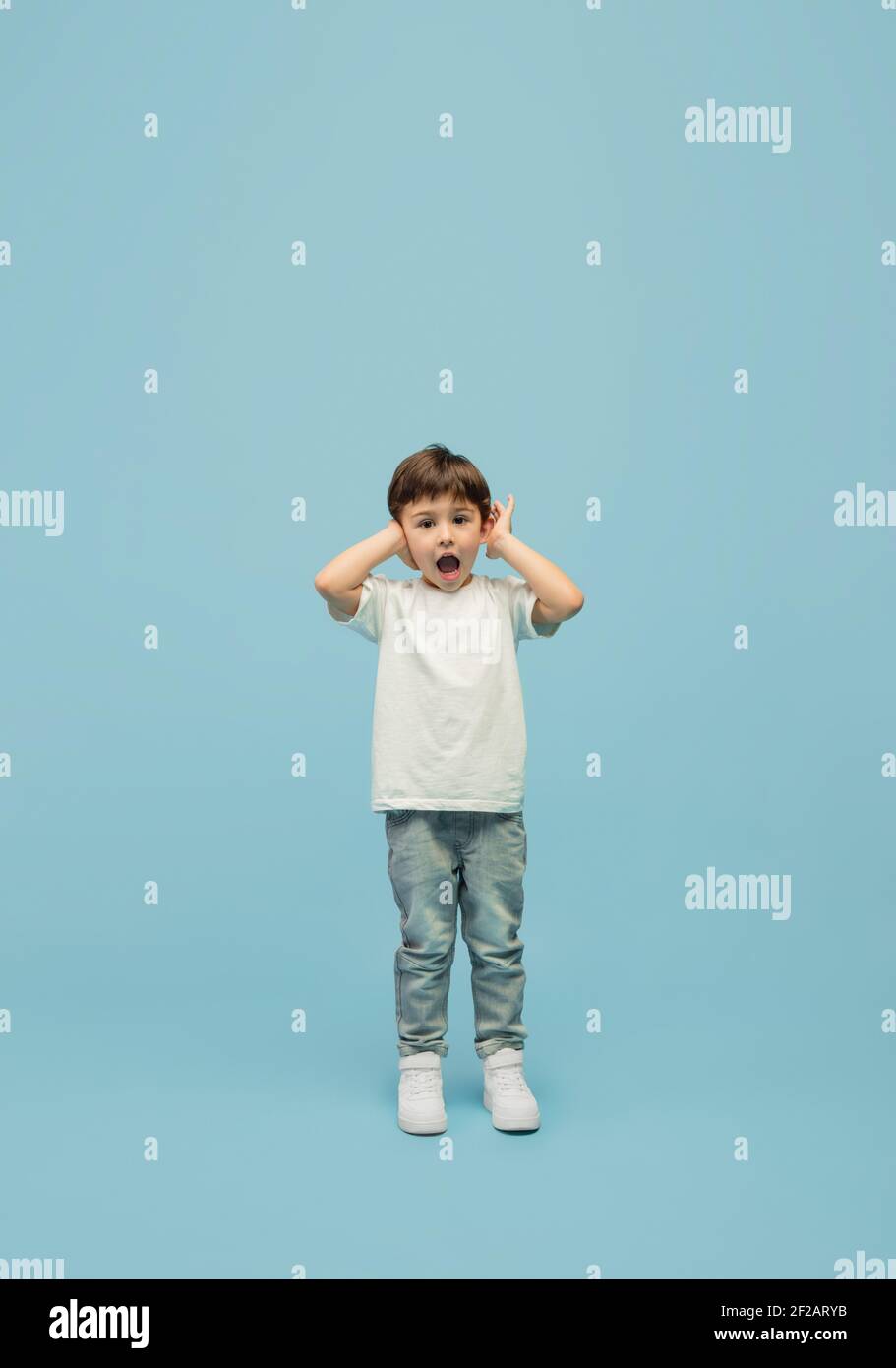 Shouting, screaming. Happy, smiley little caucasian boy isolated on ...