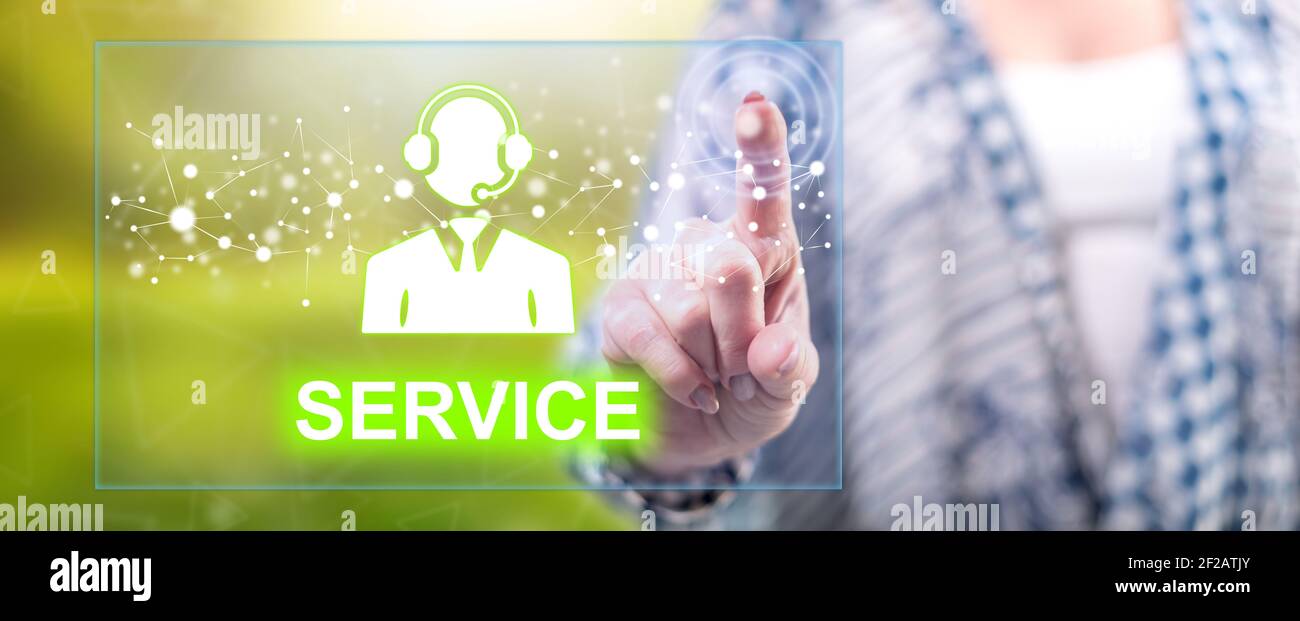 Woman touching a service concept on a touch screen with her finger ...