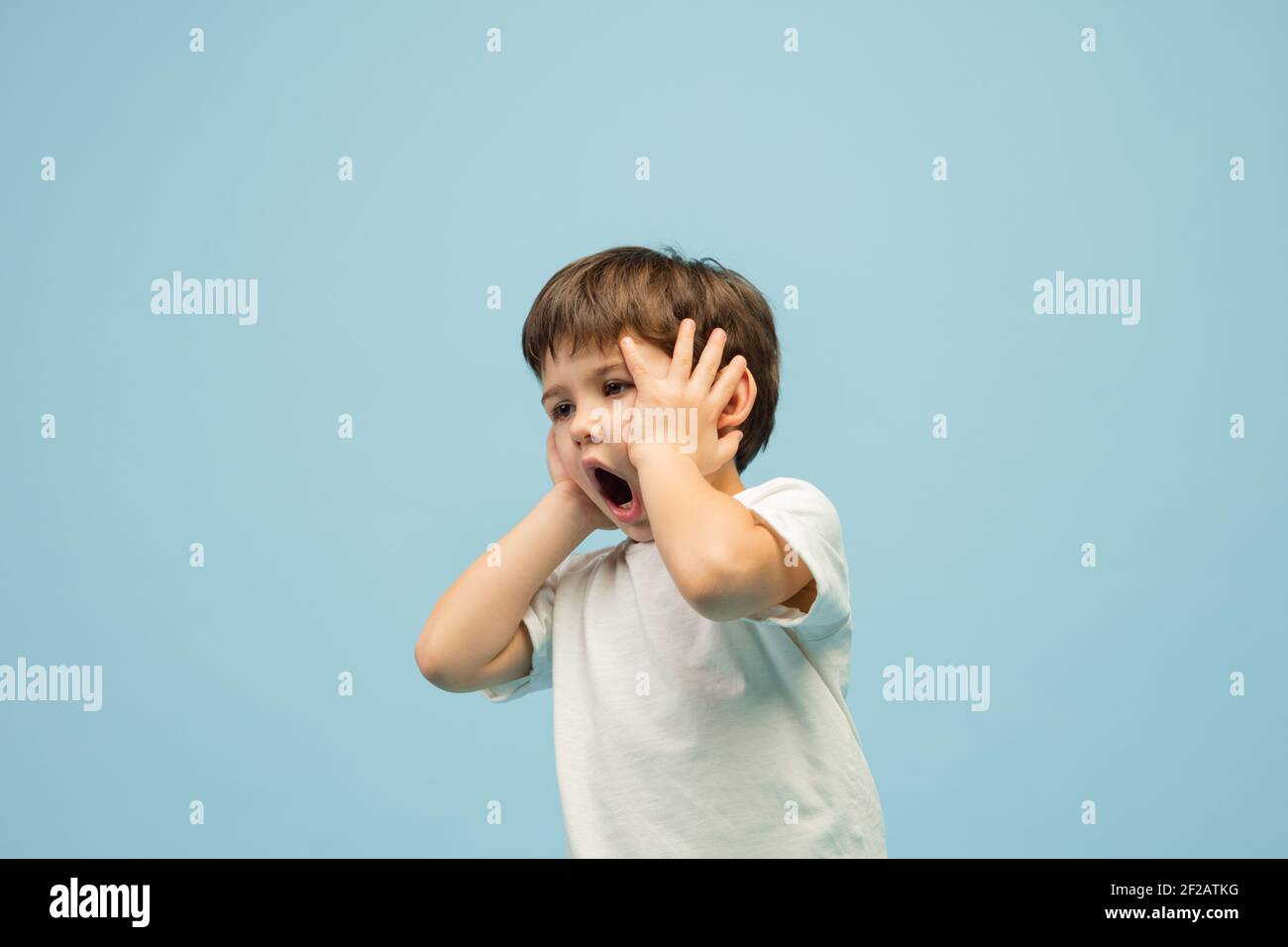 Shouting, screaming. Happy, smiley little caucasian boy isolated on ...