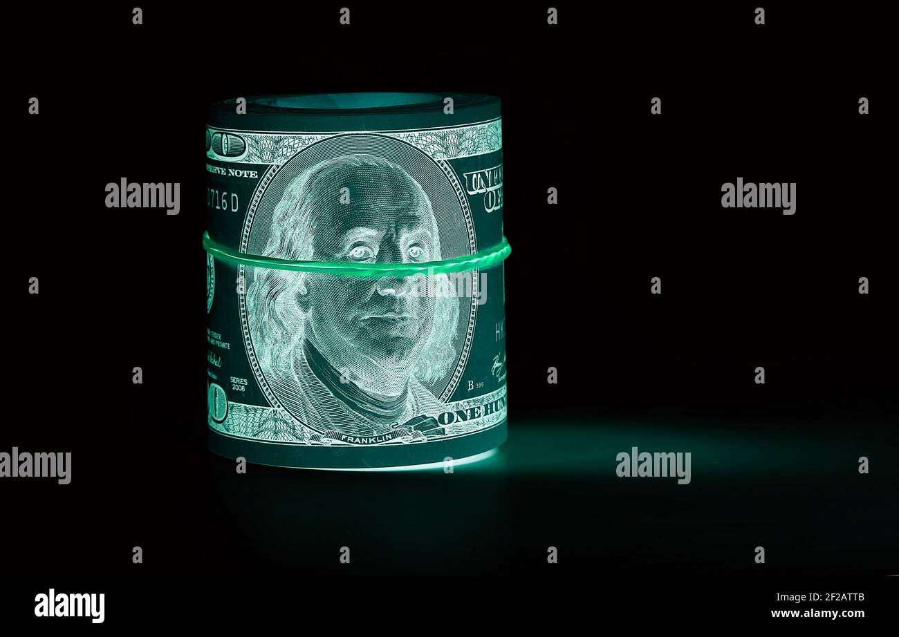 One hundred dollar bills (banknotes ) close up, U.S. currency-- in UV ...