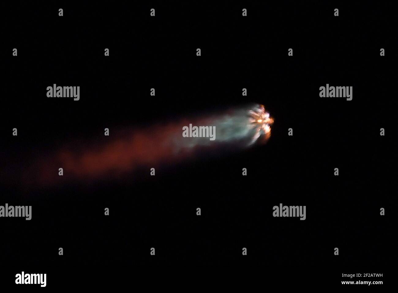 The exhaust plume changes color at altitude as a SpaceX Falcon 9 rocket ...