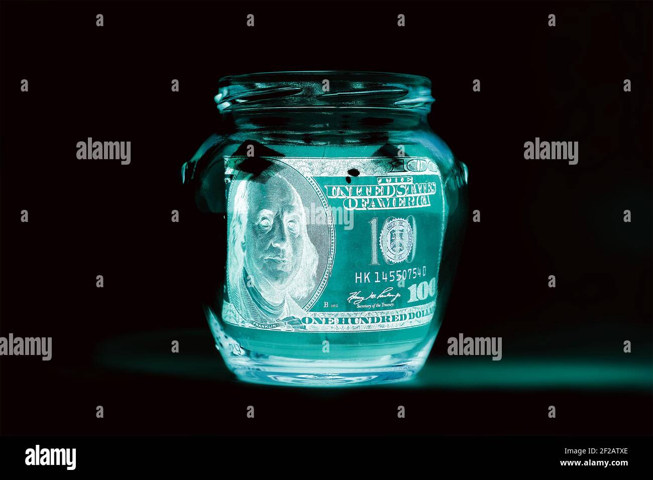 One hundred dollar bills (banknotes ) close up, U.S. currency-- in UV ...