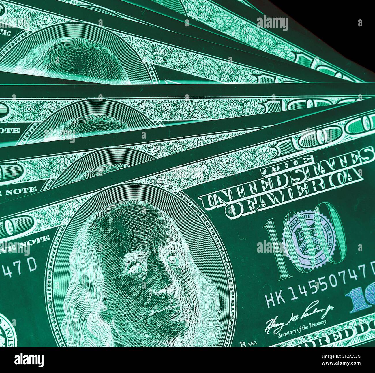 One hundred dollar bills (banknotes ) close up, U.S. currency-- in UV ...