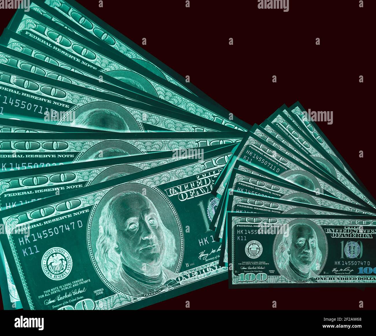 One hundred dollar bills (banknotes ) close up, U.S. currency-- in UV ...