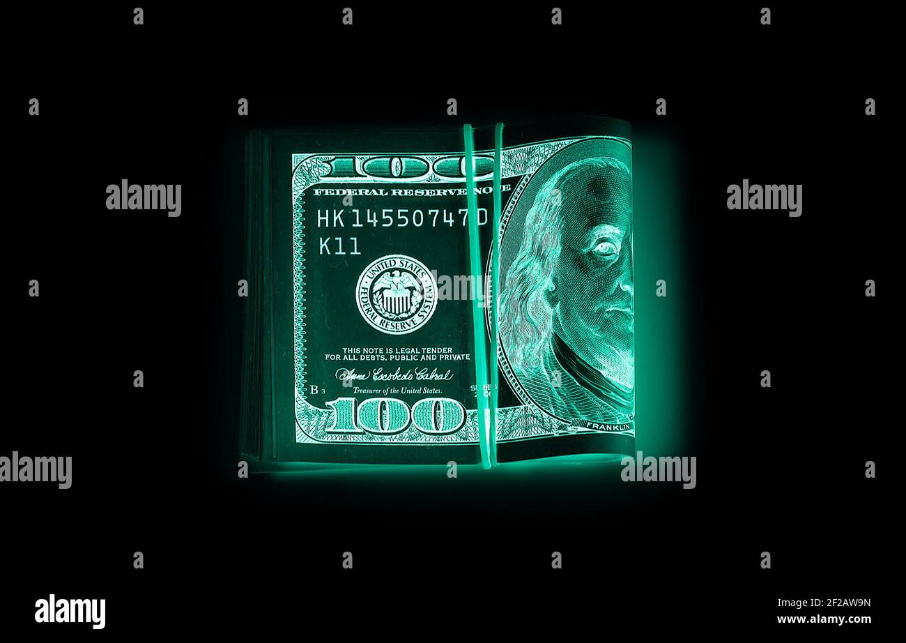 One hundred dollar bills (banknotes ) close up, U.S. currency-- in UV ...