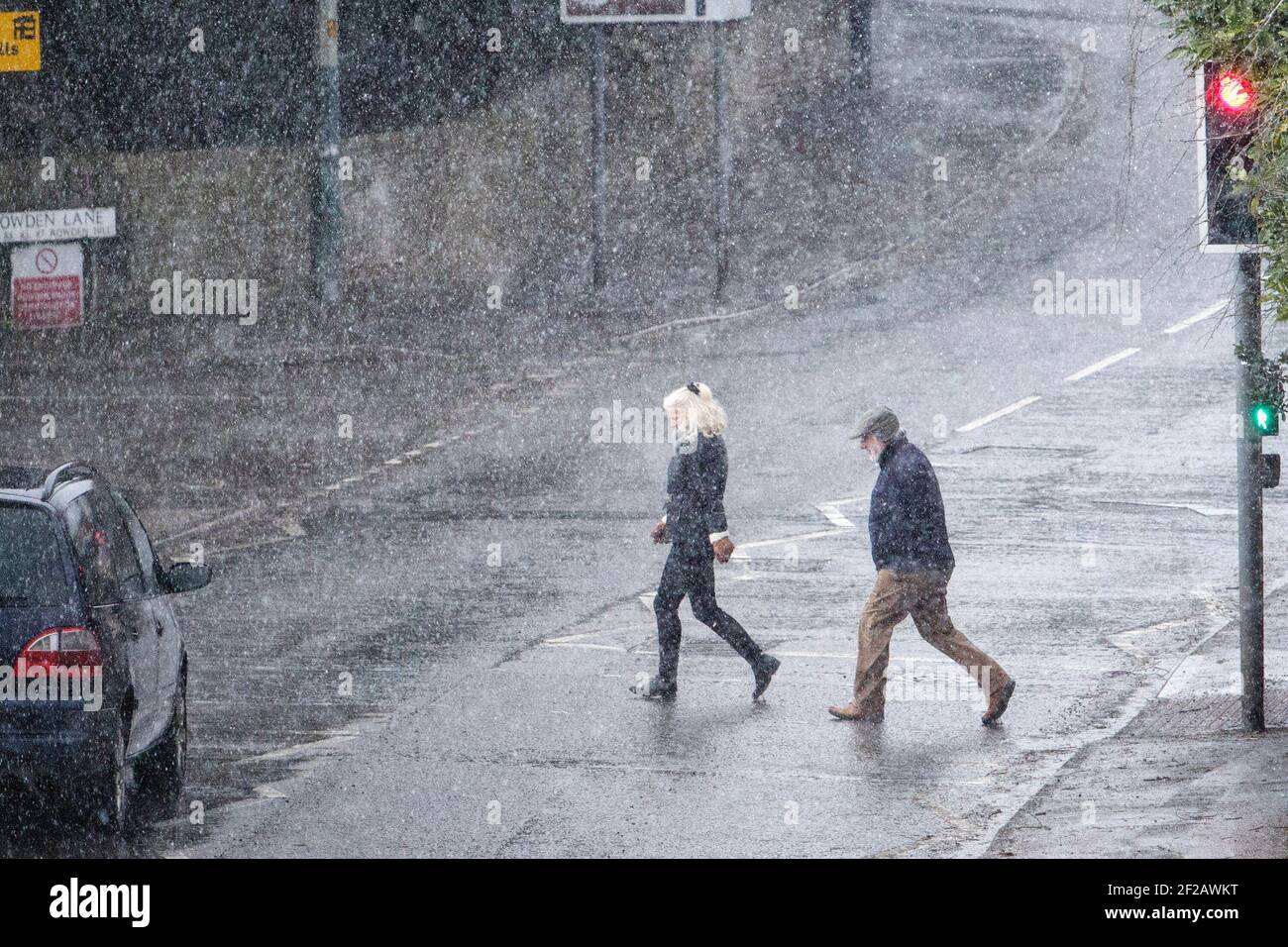 Chippenham, Wiltshire, UK, 11th March, 2021. Pedestrians are pictured ...