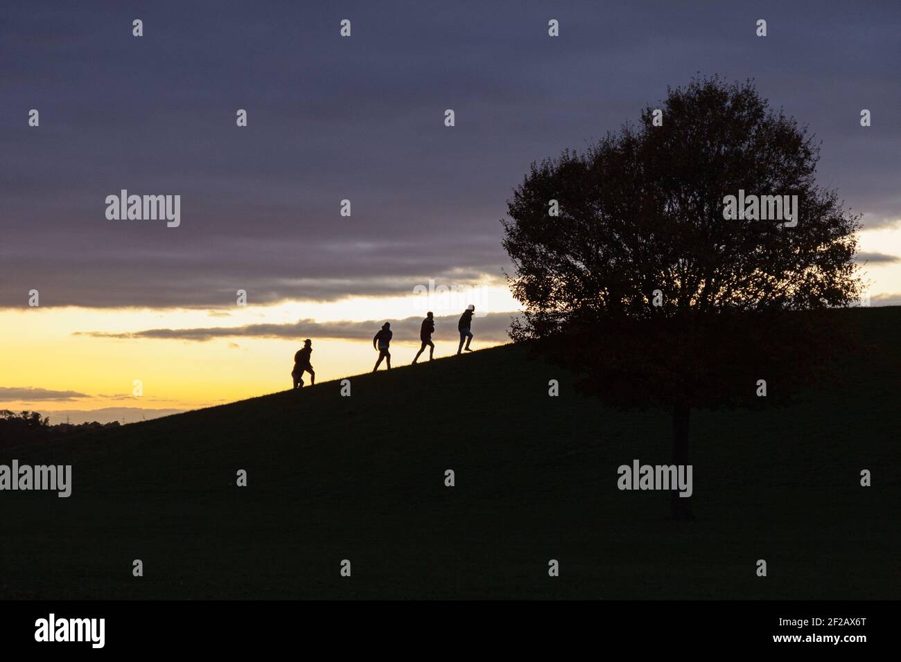 Group teens walk up hill hi-res stock photography and images - Alamy