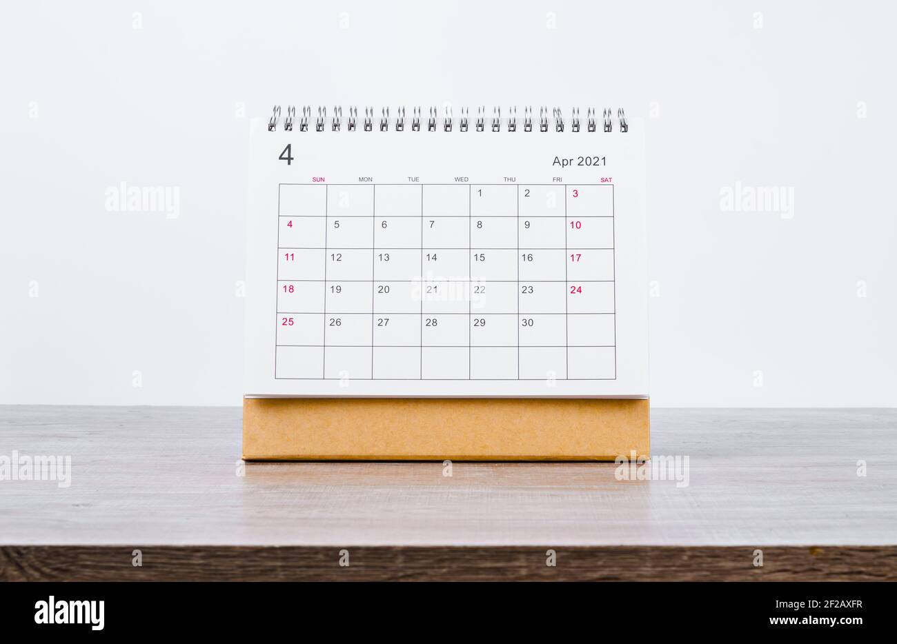 April Calendar 2021 on wooden table background Stock Photo - Alamy
