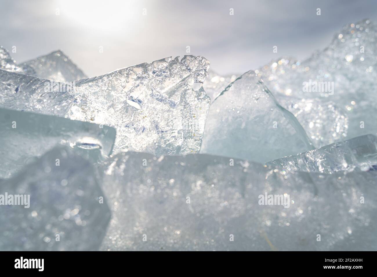 A closeup of transparent shining clear ice sparkling on frozen wild ...