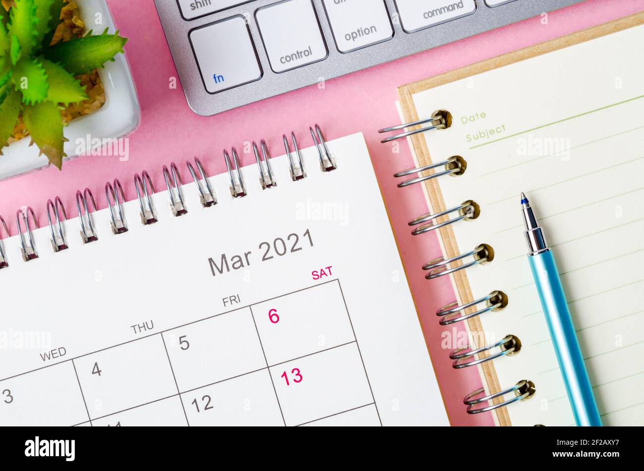 March 2021 calendar with note book on pink background Stock Photo - Alamy