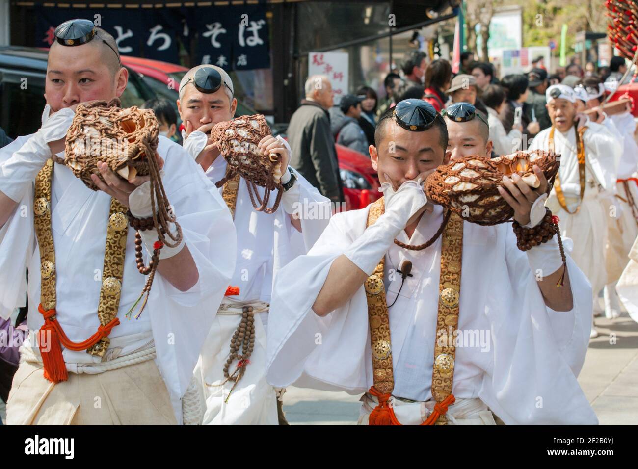 Yamabushi Buddhist pilgrims playing horagai conch shell instrument in ...