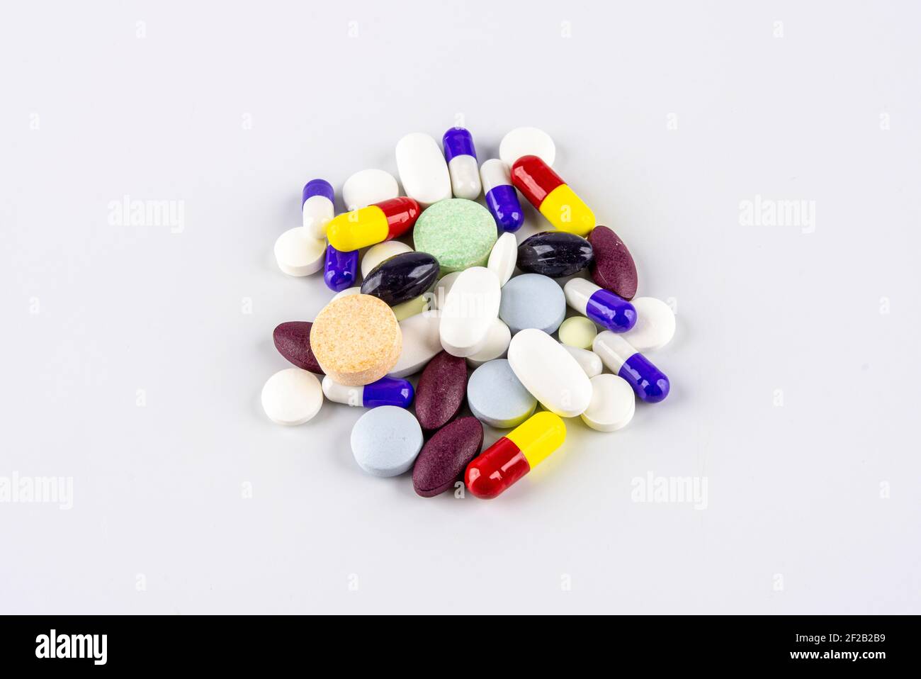 Group of pills, capsules and other coloful medications over white ...
