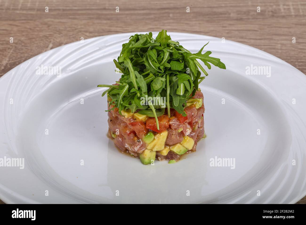 Raw Tuna fish Tartar snack with spices Stock Photo - Alamy