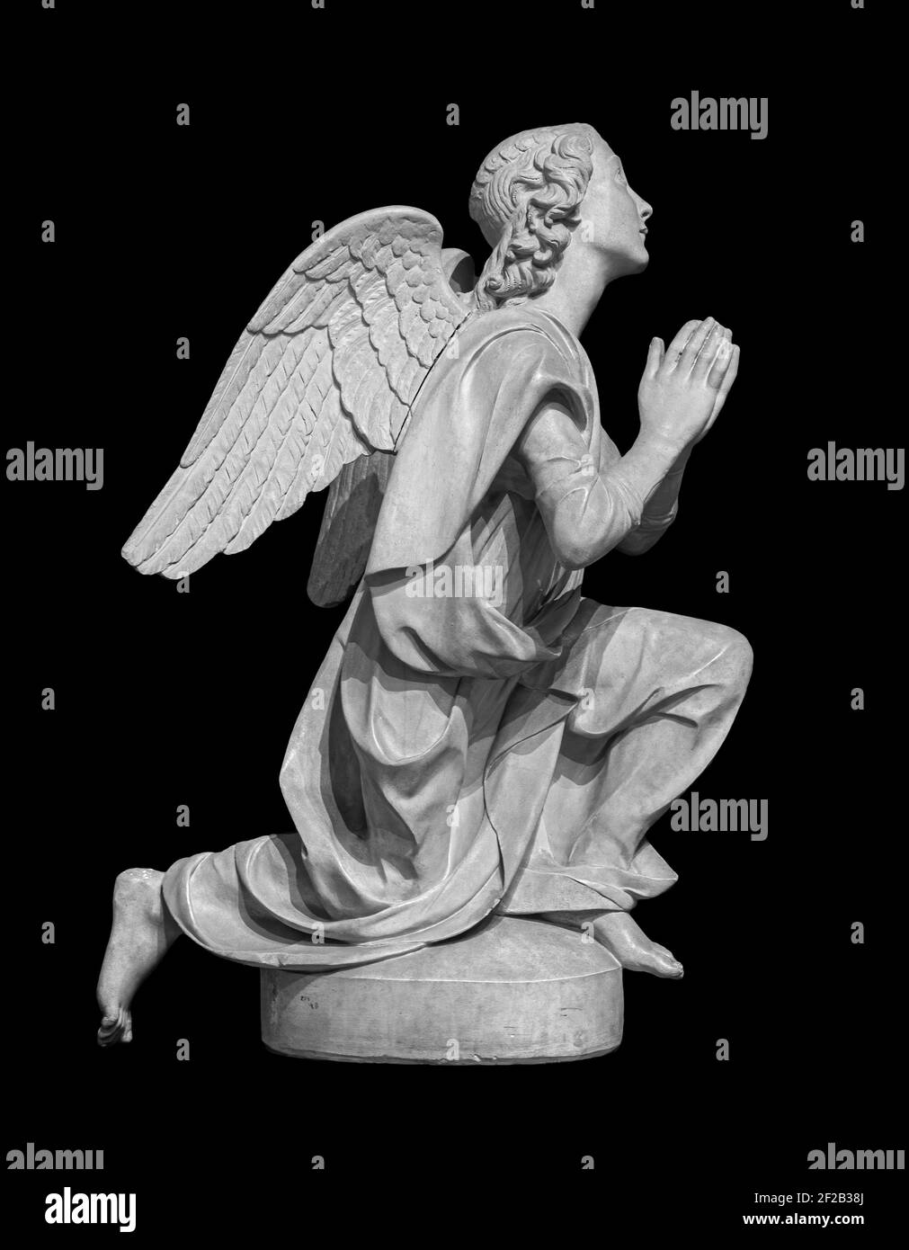 Angel statue isolated on black background. White stone sculpture of ...