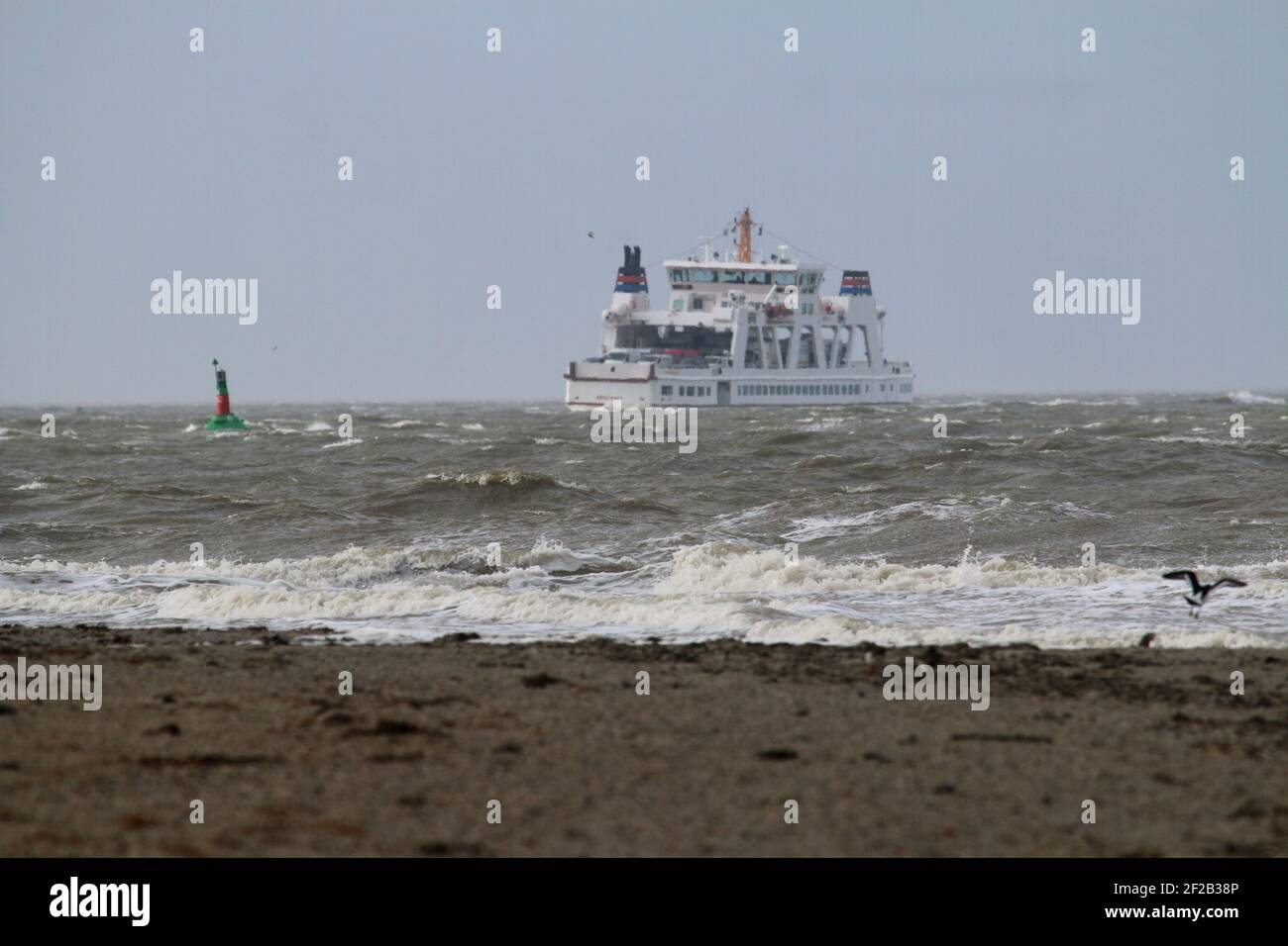 Norderney, Germany. 11th Mar, 2021. A ferry is seen on the North Sea ...