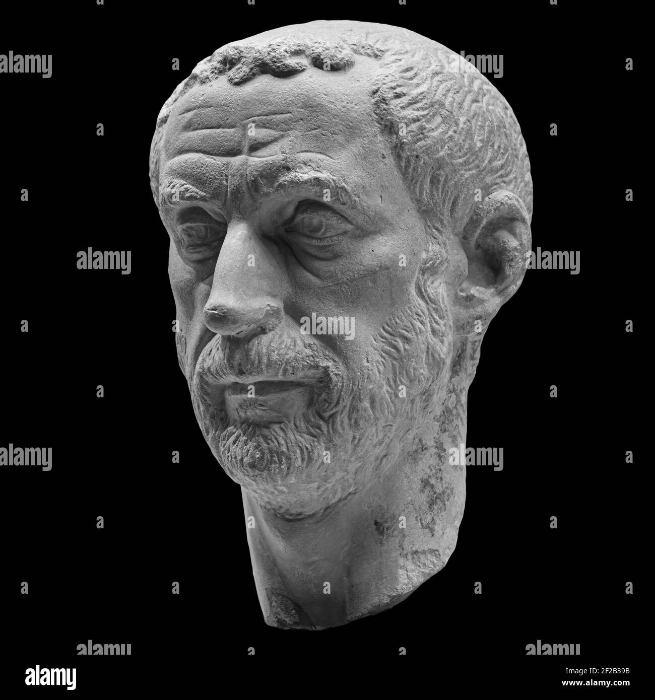 Head detail of the ancient man sculpture. Stone face isolated on black ...