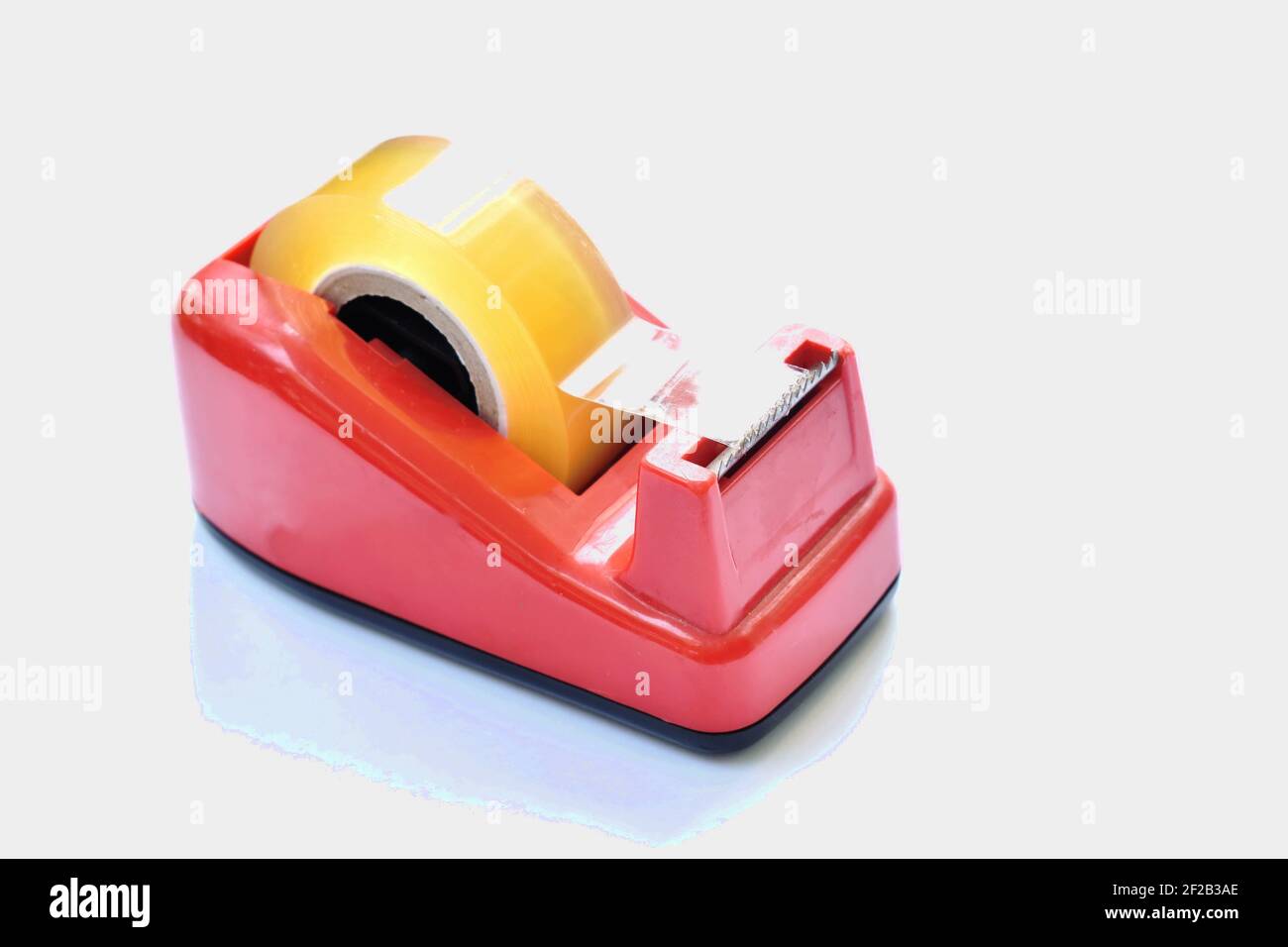red tape dispenser office supply arranging on white background Stock ...