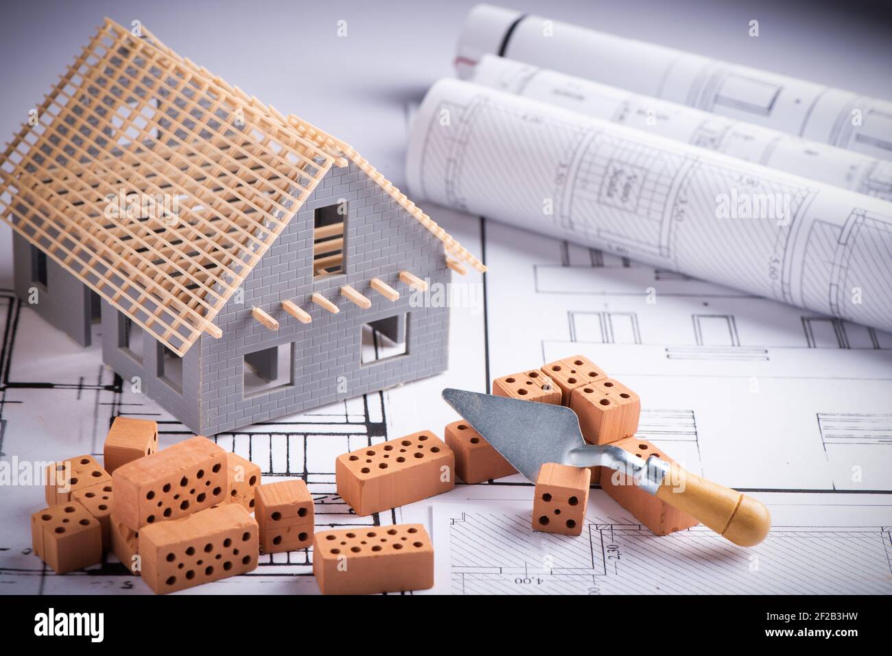 House in construction - project with brick and blueprint close up Stock ...