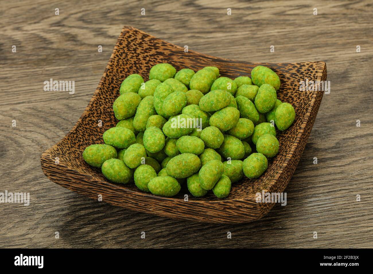 Spicy wasabi peanuts snack in the bowl Stock Photo - Alamy