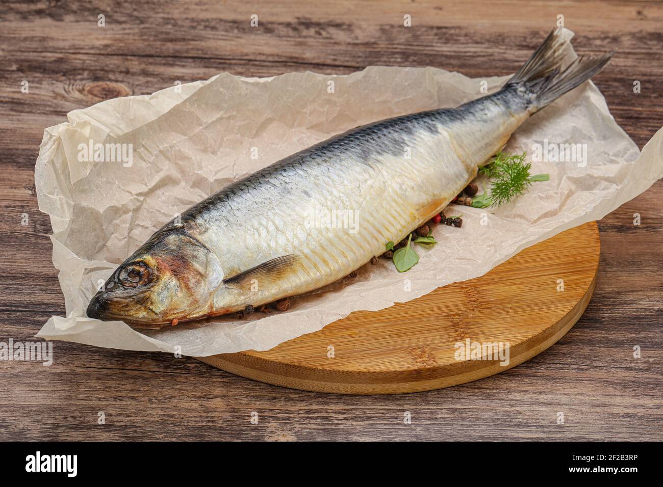 Salted Herring fish with pepper and spices Stock Photo - Alamy