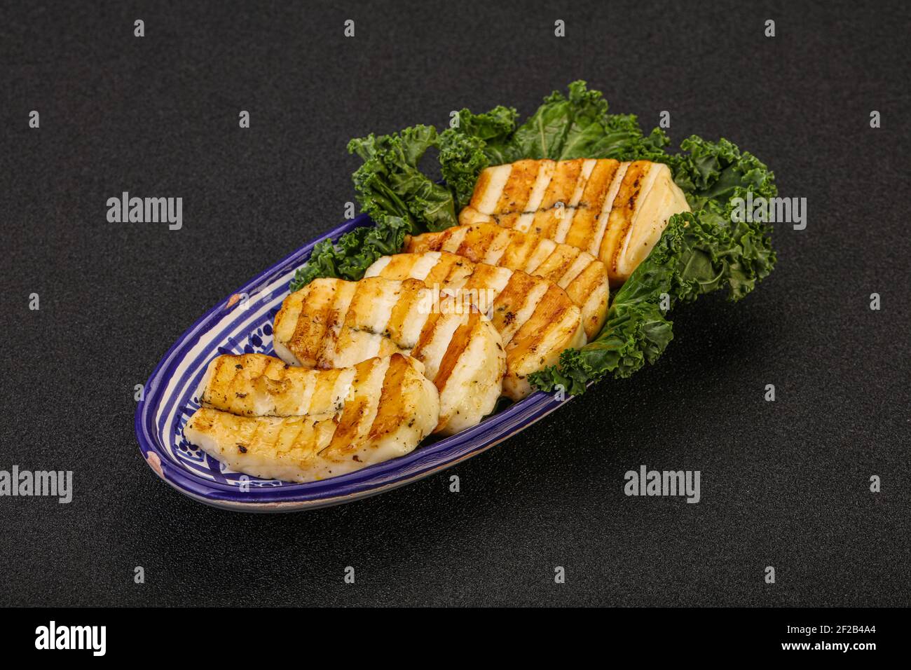 Grilled Greek haloumi cheese with herbs and spices Stock Photo - Alamy