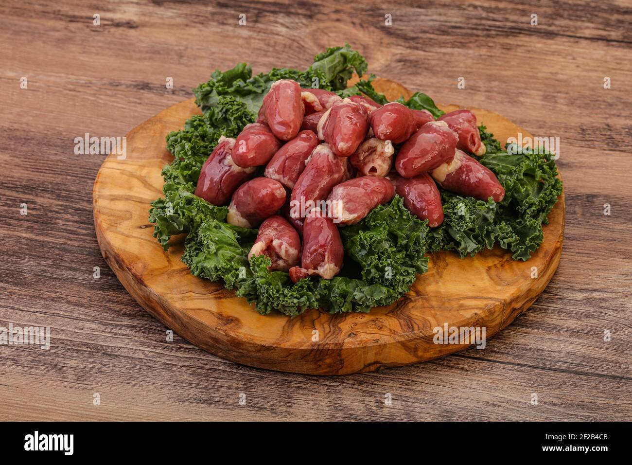 Raw chicken hearts heap for cooking Stock Photo - Alamy