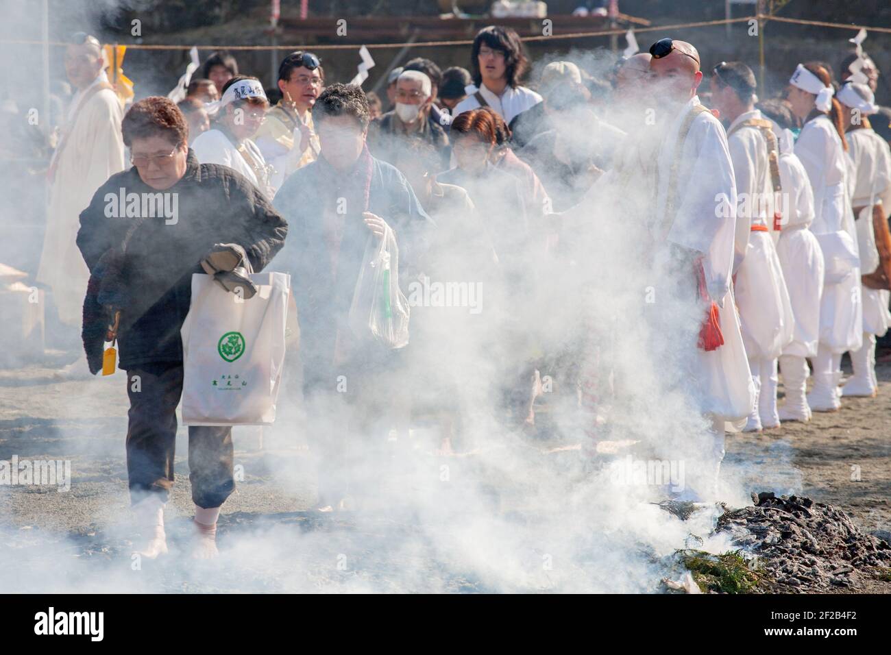Japanese participants firewalking on burning coals at the Hiwatari ...
