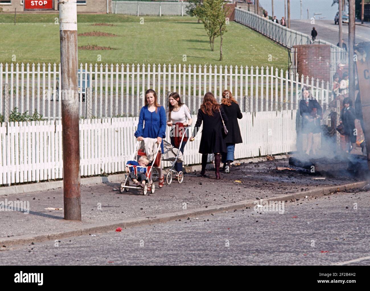 BELFAST, UNITED KINGDOM - JUNE 1972. School Children passing infront of ...