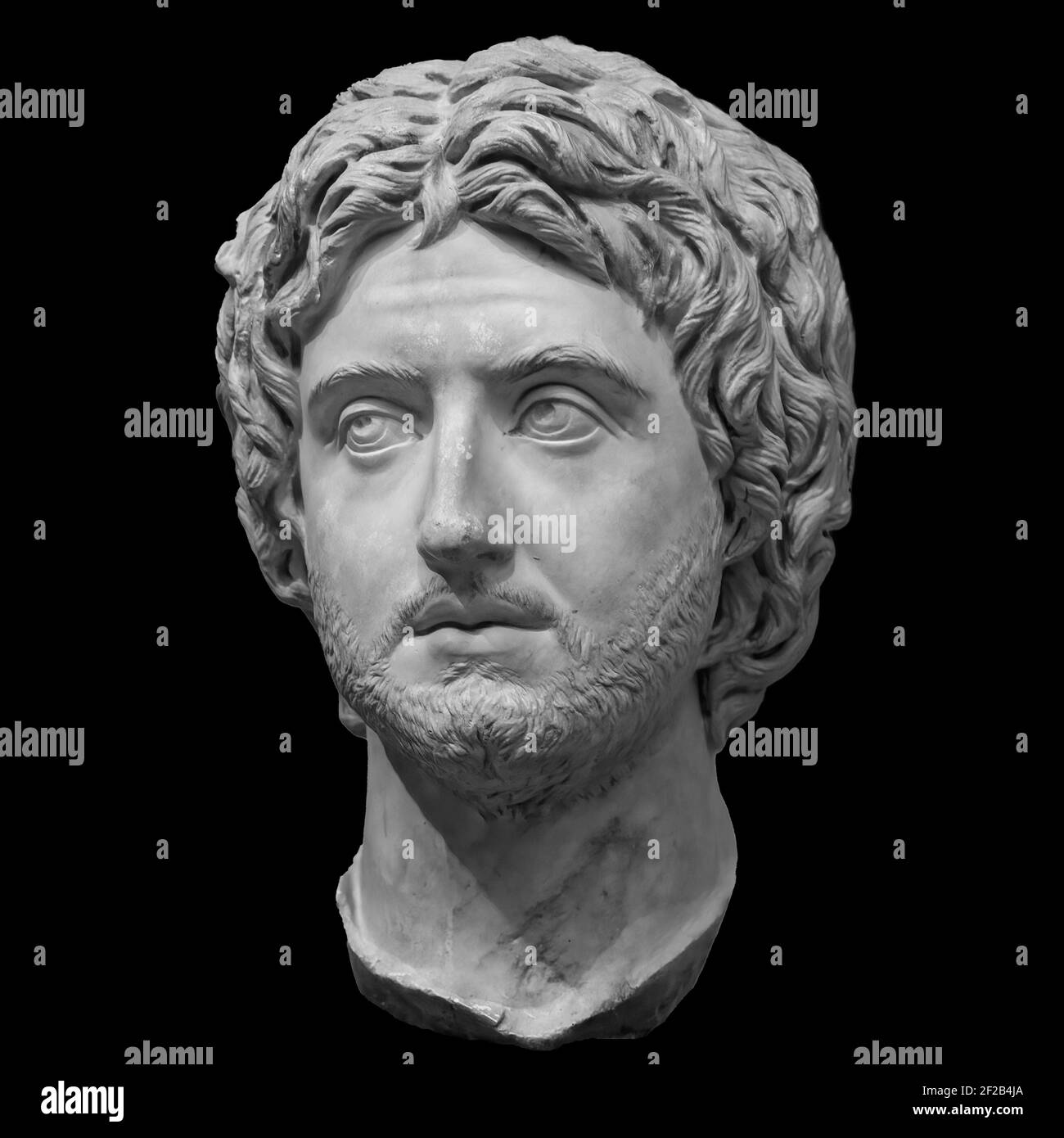 Head detail of the ancient man sculpture. Stone face isolated on black ...