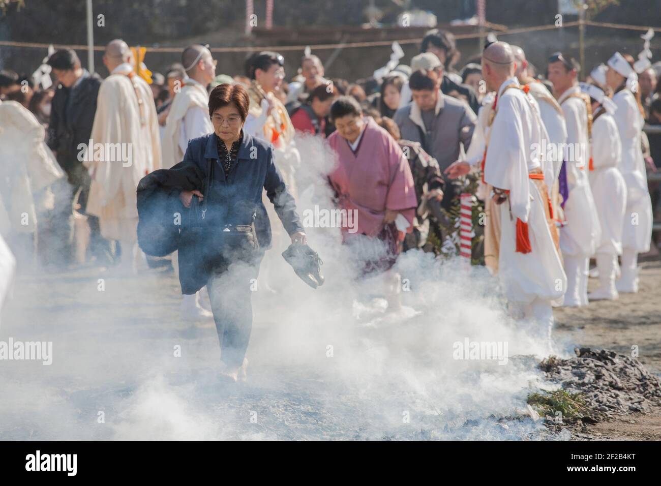 Japanese participants firewalking on hot coals at the Hiwatari Matsuri ...