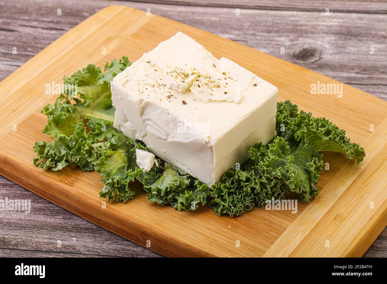 Traditional tasty Greek Feta soft cheese brick Stock Photo - Alamy