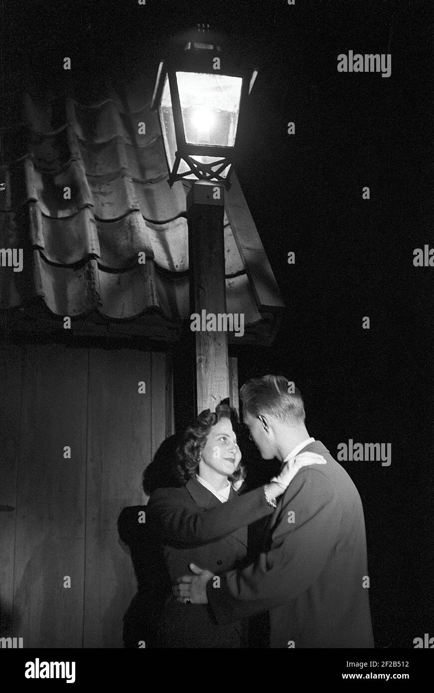 Old woman and young man kissing hi-res stock photography and images - Alamy