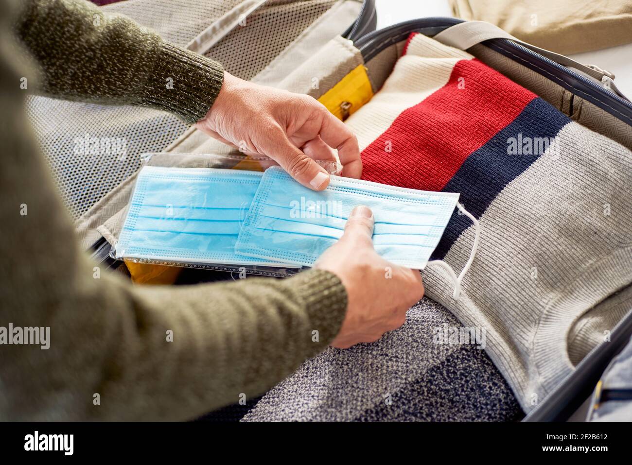Man packing suitcase hi-res stock photography and images - Alamy