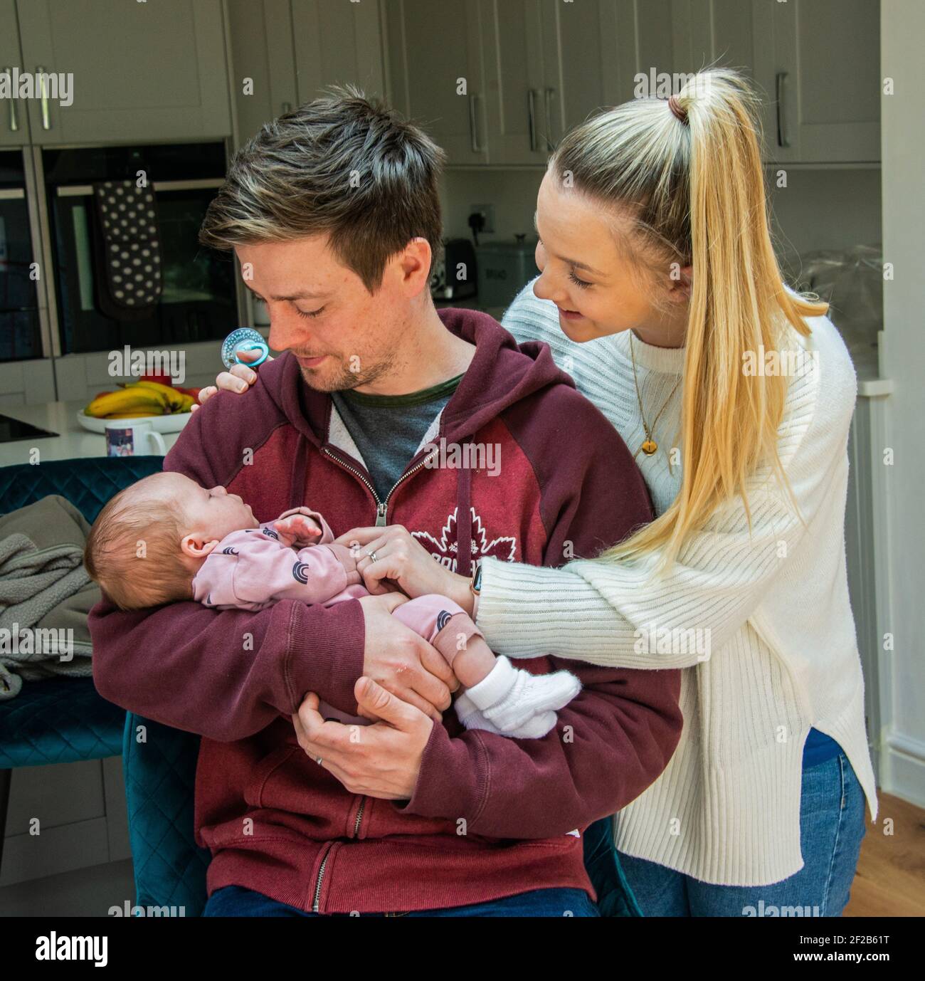 young couple with their new-born baby Stock Photo - Alamy