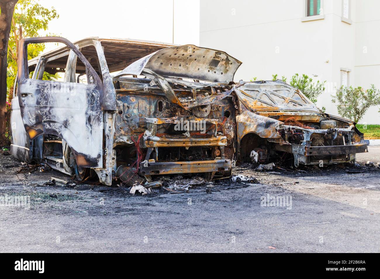 Remains of a car and van destroyed by fire Stock Photo - Alamy