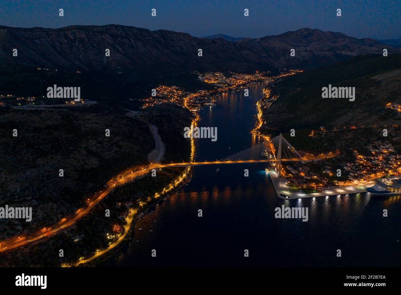Aerial drone shot of Port Gruz by Dubrovnik bridge with lights in ...