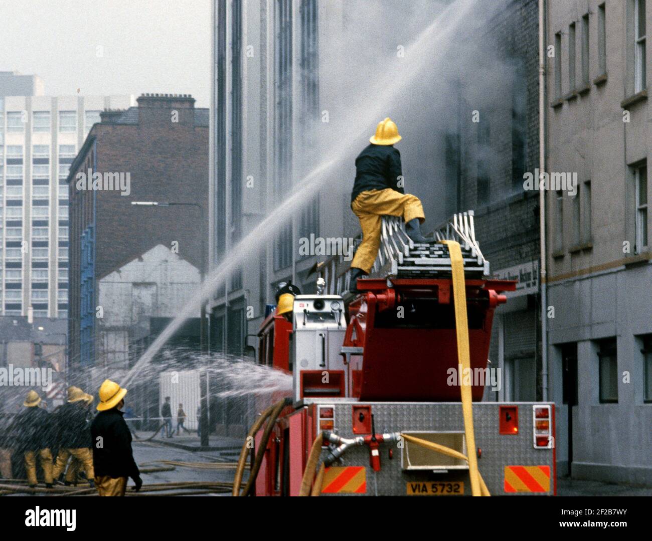 Firemen fighting a firebomb incident in Belfast during The Troubles ...