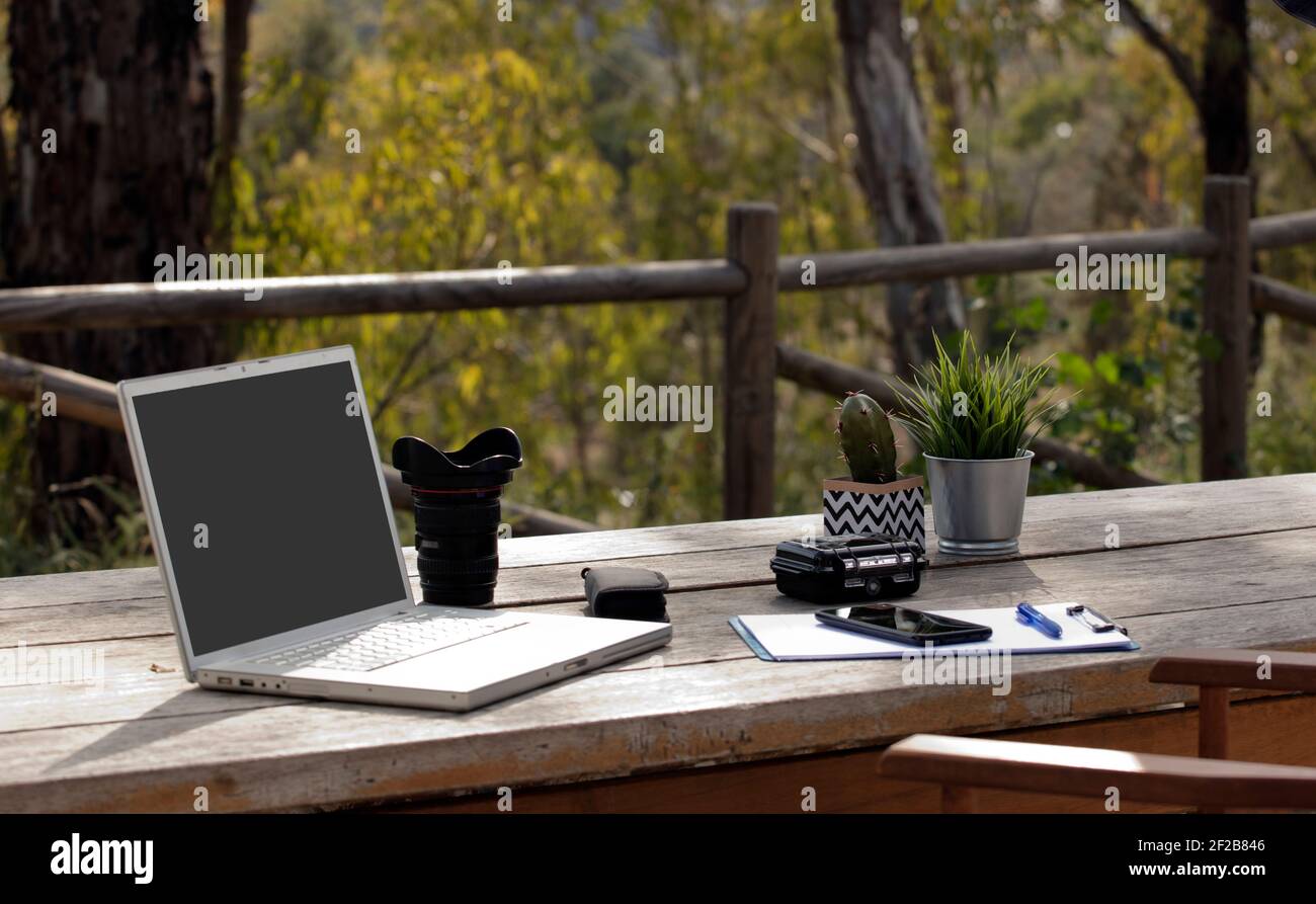 outdoor influencer work table with computer, and stationery Stock Photo ...