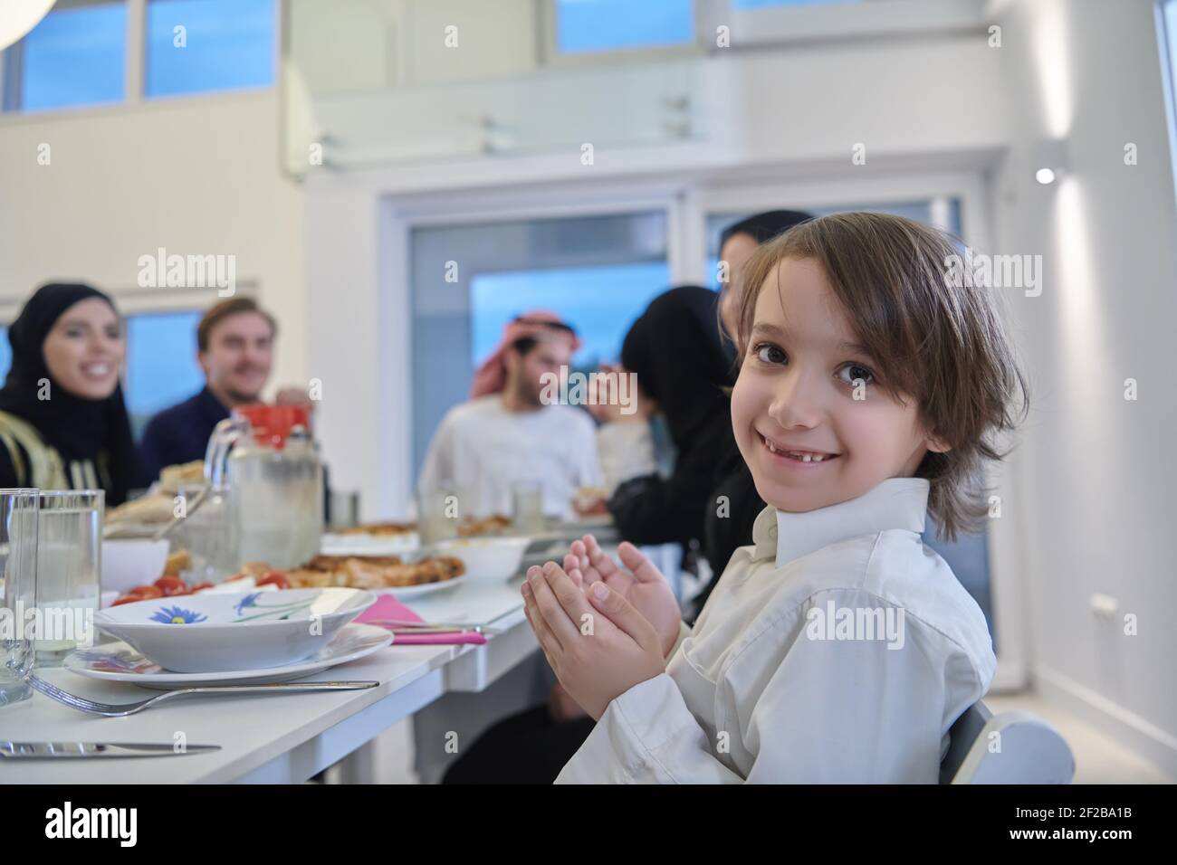 Muslim family making iftar dua to break fasting during Ramadan Stock ...