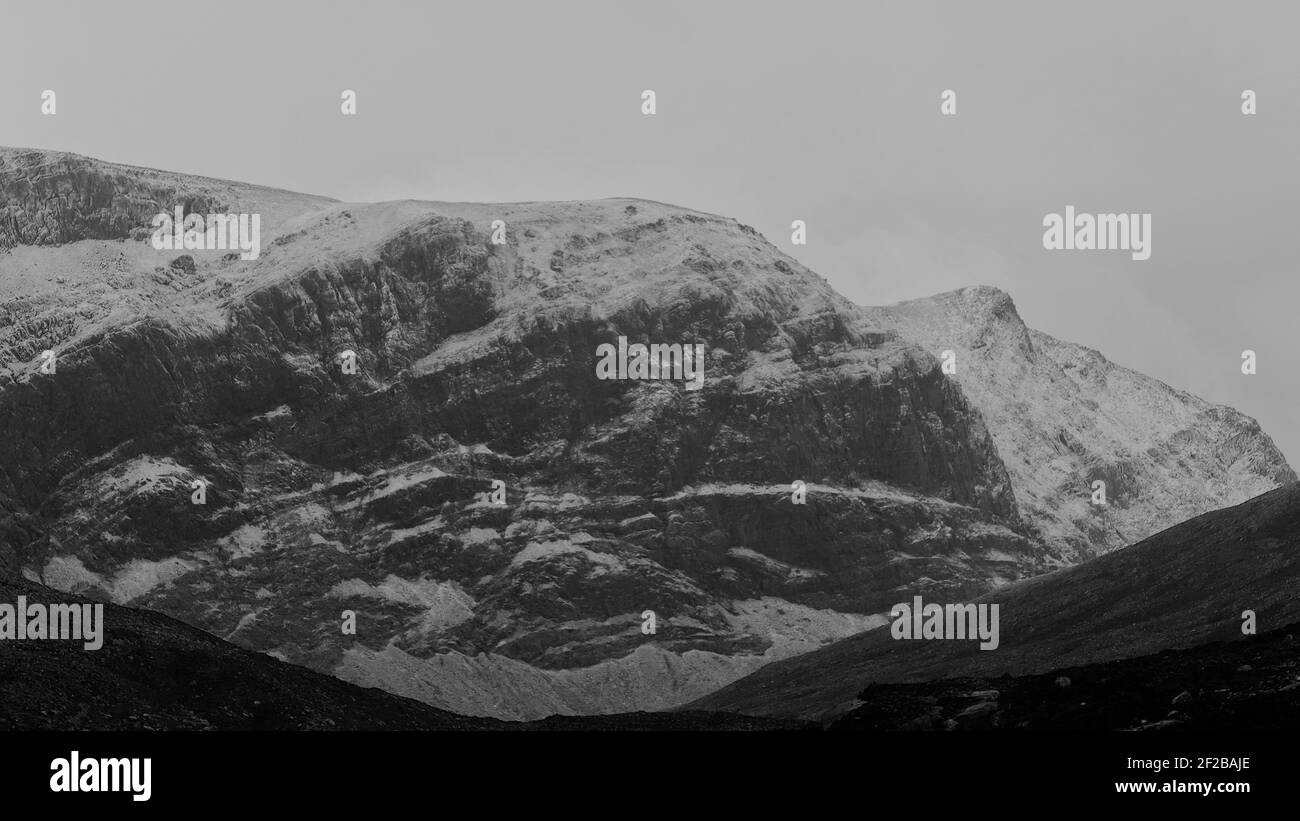 Snow capped black mountain Black and White Stock Photos & Images - Alamy